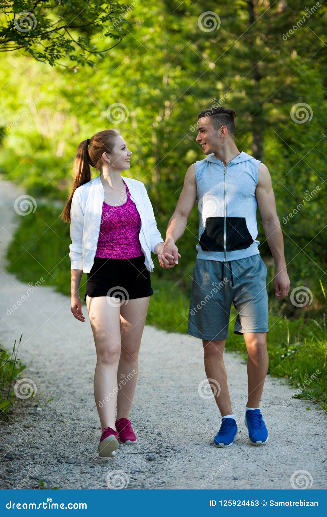 Active Young Couple on a Wlak in the Park Stock Image - Image of black ...