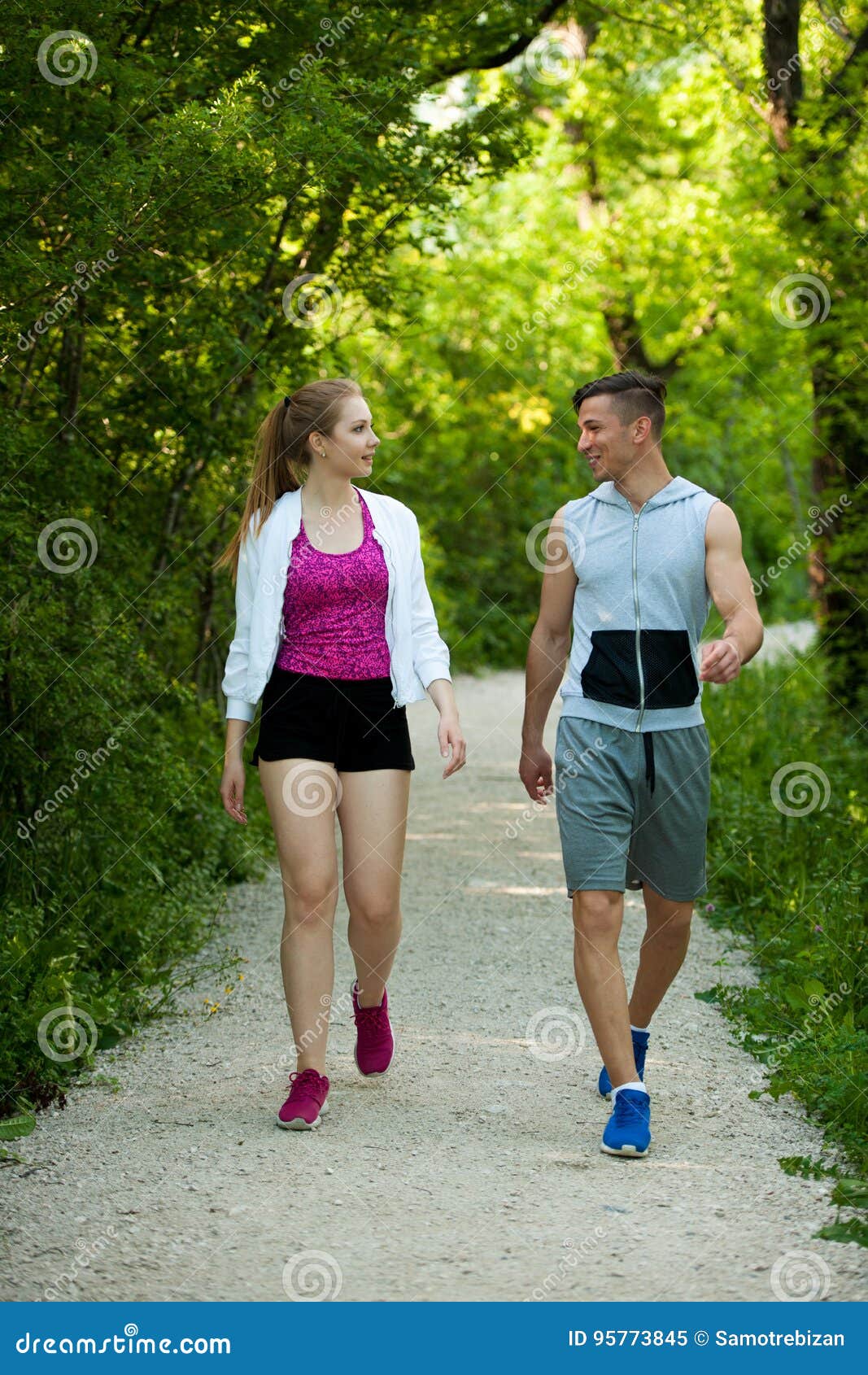 Active Young Couple on a Wlak in the Park Stock Image - Image of ...