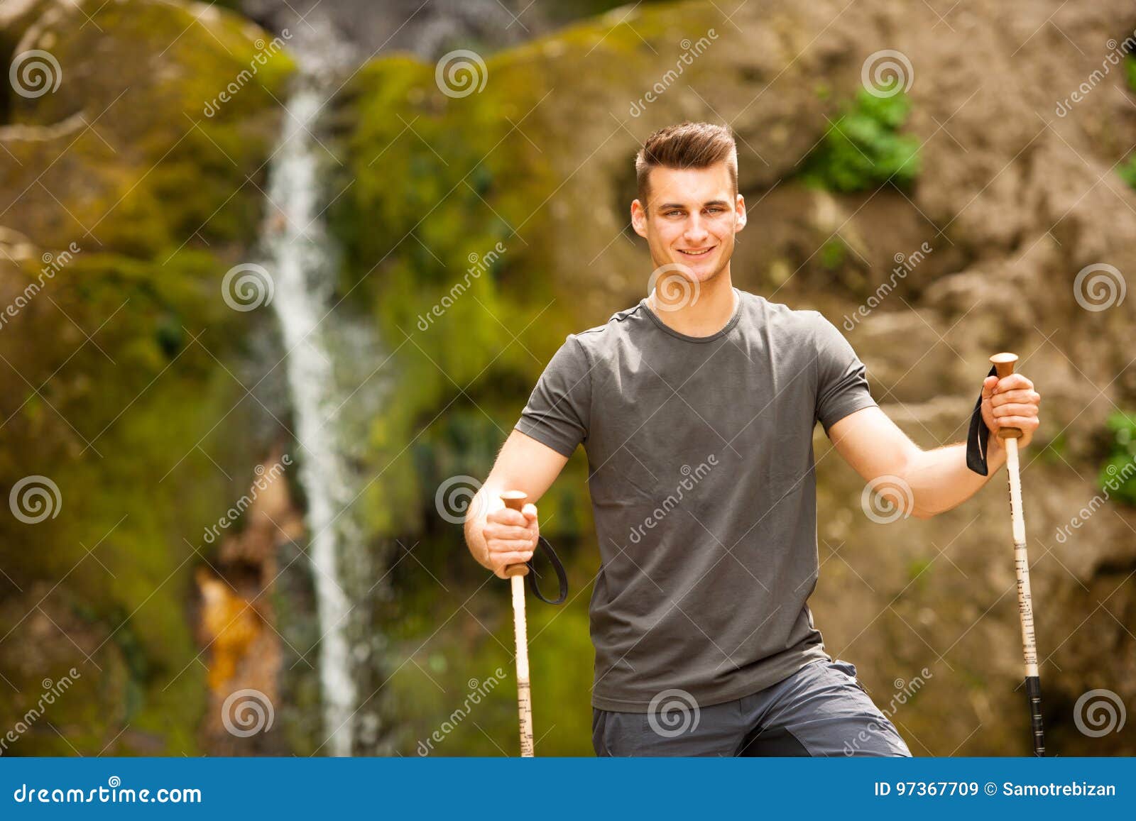 Active Young Man Hiking in Mountains Near Waterfall on a Creek Stock ...