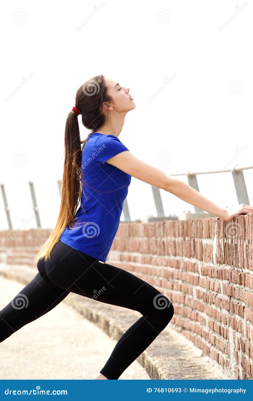 Active Young Woman in Pushing Against Wall Stock Image - Image of ...