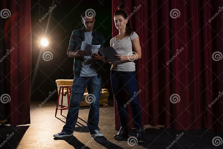 Actors Reading Their Scripts on Stage Stock Photo - Image of casual ...