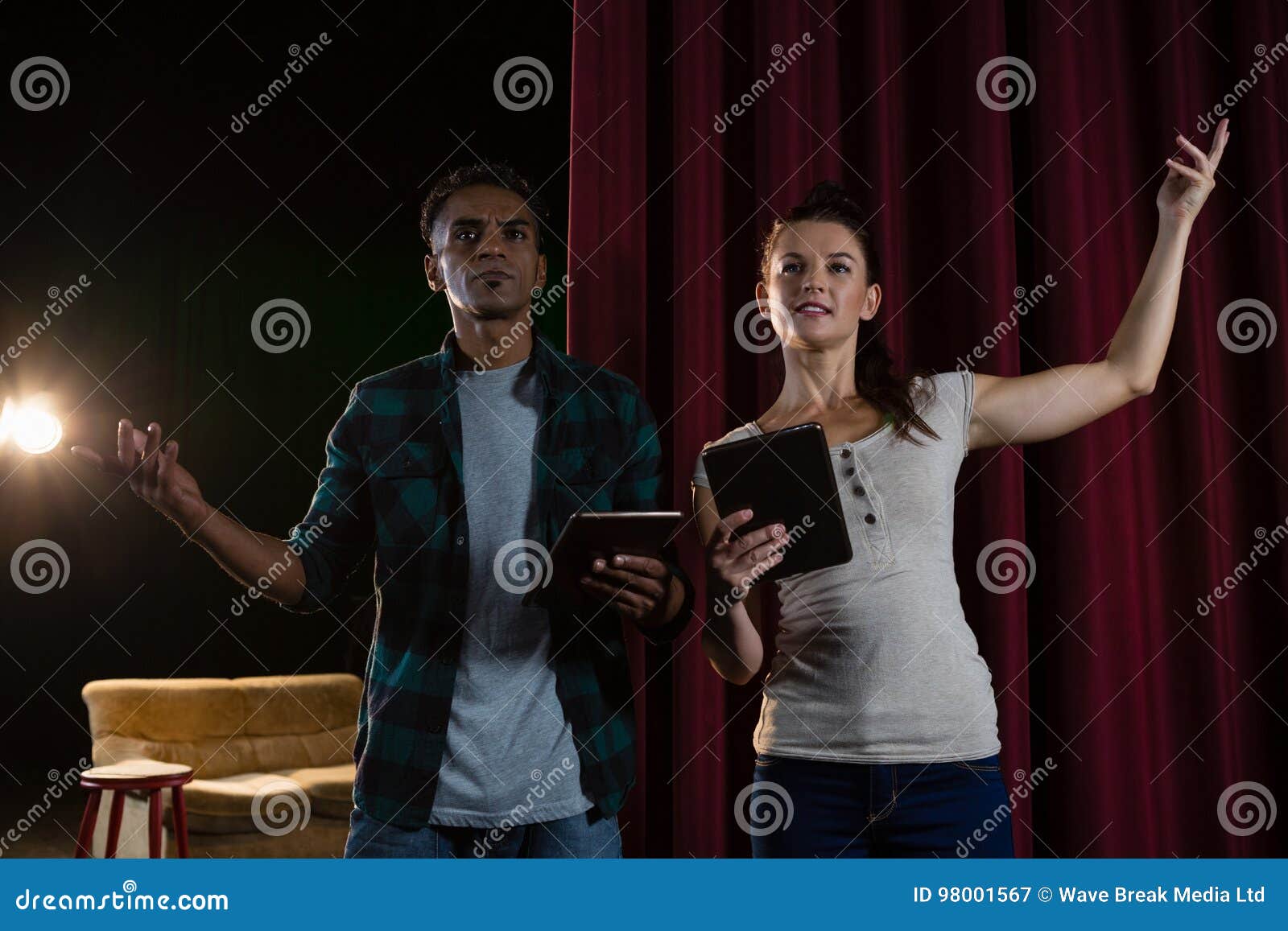 Actors Rehearsing on Stage while Using Digital Tablet Stock Image ...