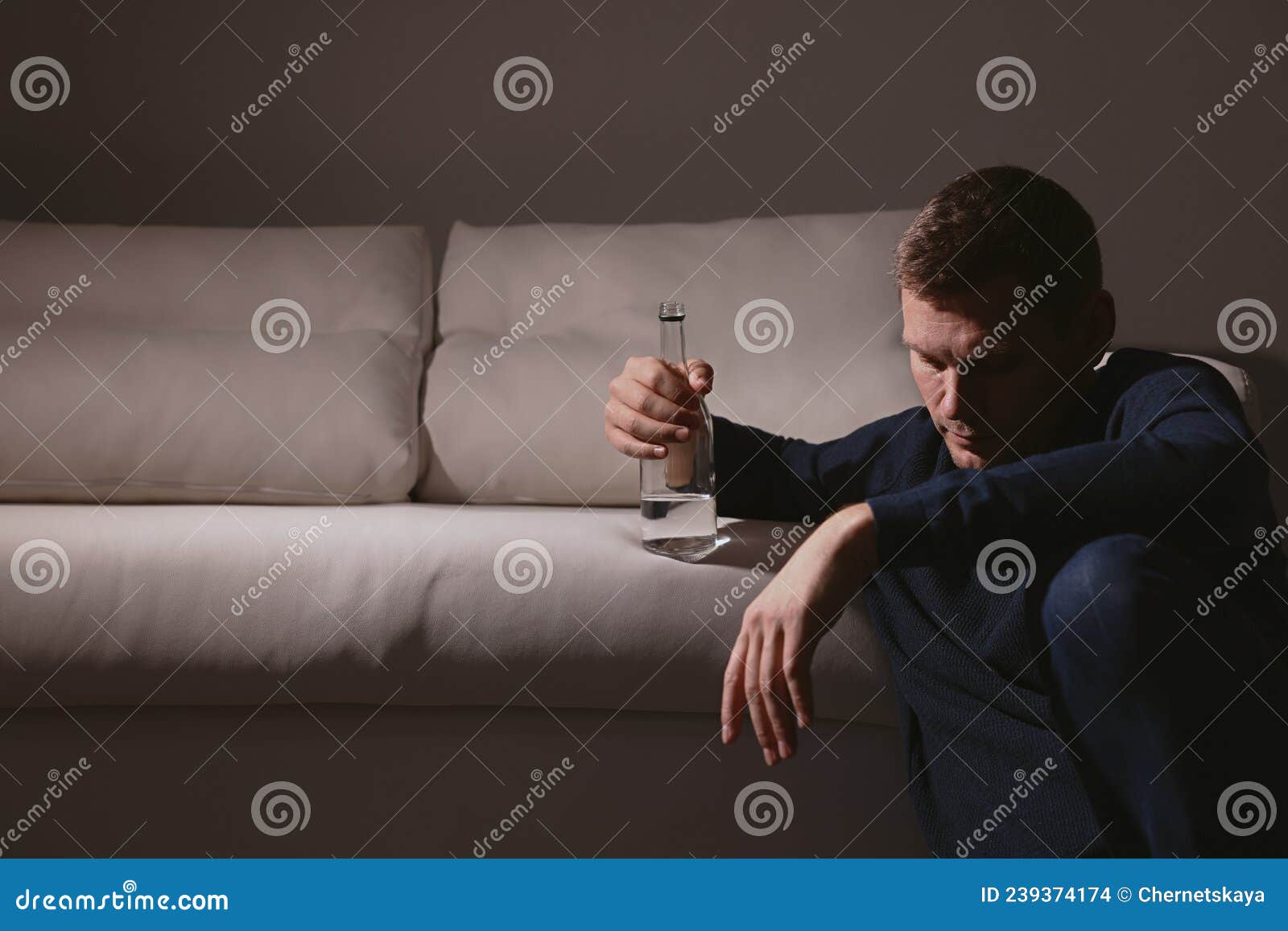 Addicted Man with Alcoholic Drink Near Sofa Indoors. Space for Text ...