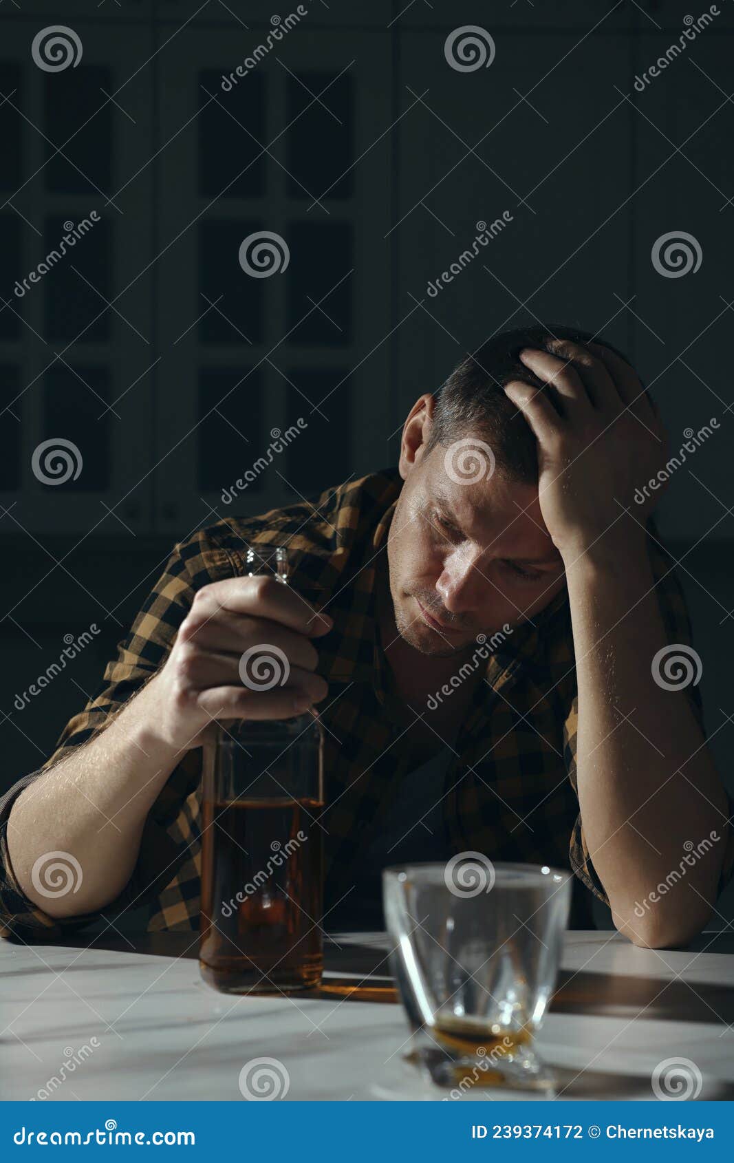 Addicted Man with Alcoholic Drink at Table in Kitchen Stock Photo ...
