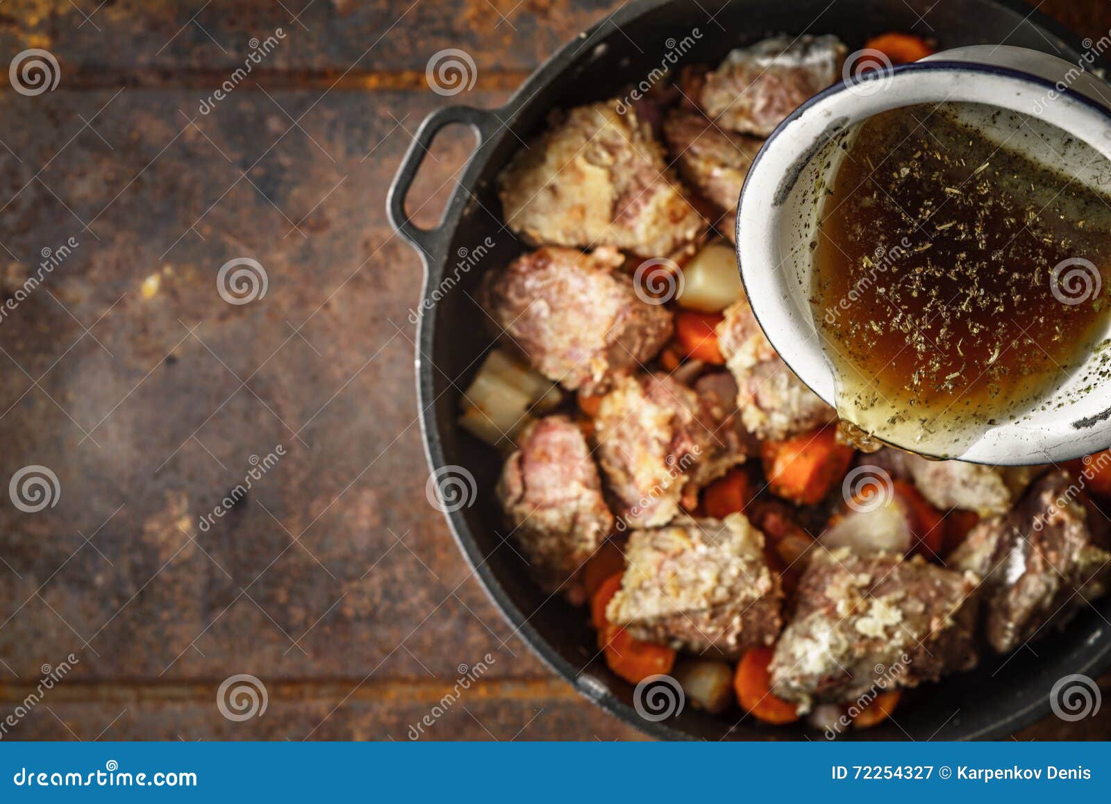 Adding Broth in the Pan with Meat and Vegetable Top View Stock Image ...