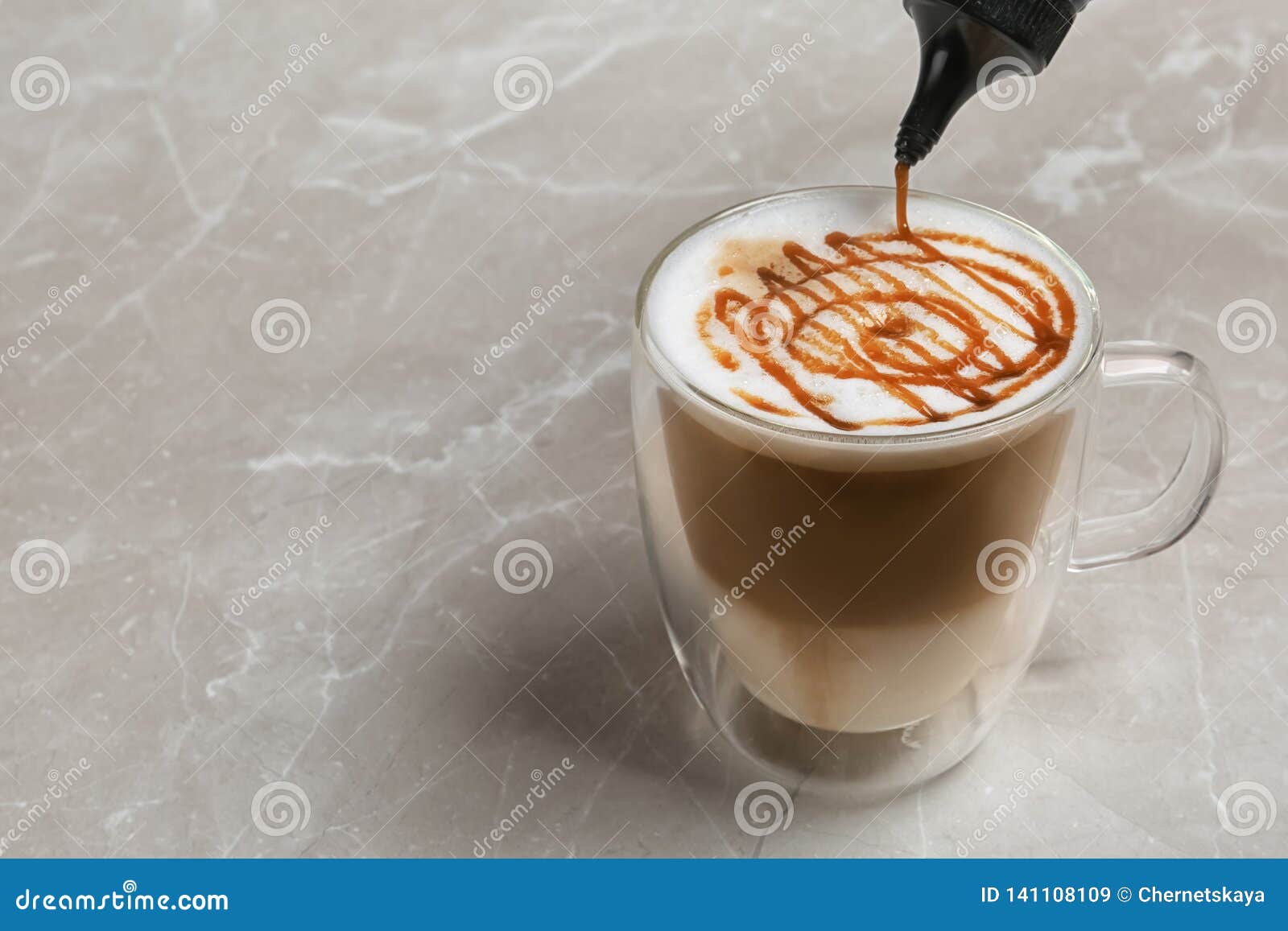 Adding Caramel Topping To Latte Macchiato on Table Stock Image - Image ...