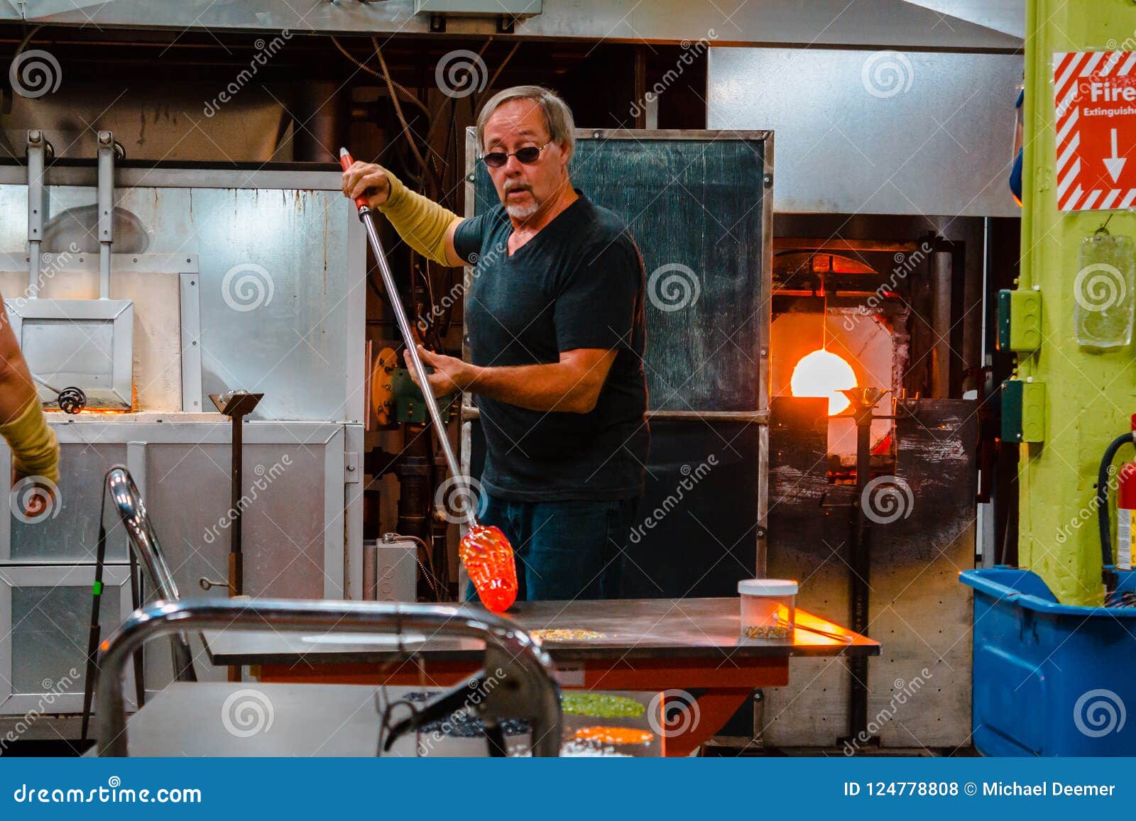 Adding Colored Glass To Molten Glass To Give it Some Color Editorial ...