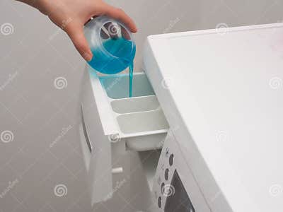 Adding Detergent To Dispenser Stock Photo - Image of machine, fluid ...