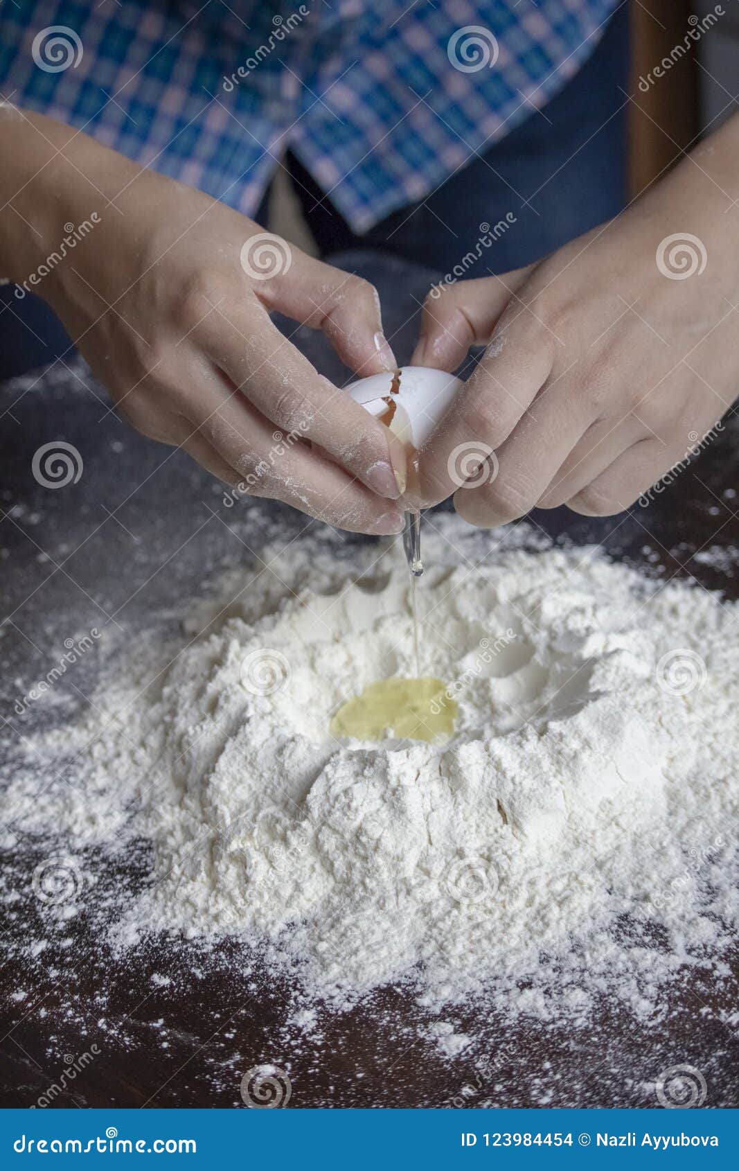 Dough Preparation Process of Adding Egg To the Flour Stock Photo ...