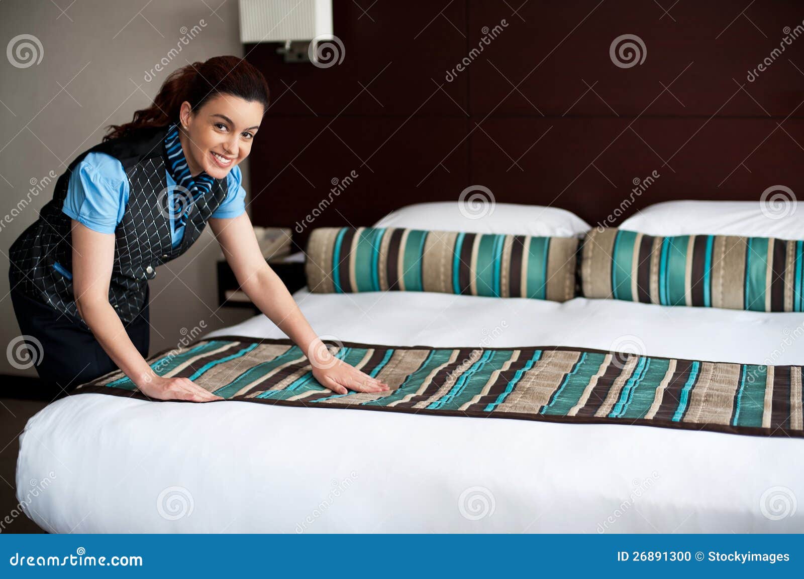 Adding Final Touches To Bedroom Stock Photo - Image of beautiful ...
