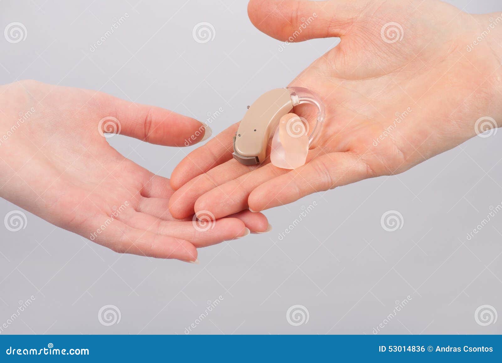Adding a hearing aid stock photo. Image of instrument - 53014836