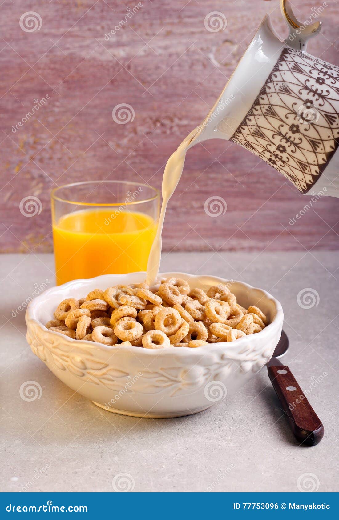 Adding milk into breakfast stock photo. Image of grain - 77753096