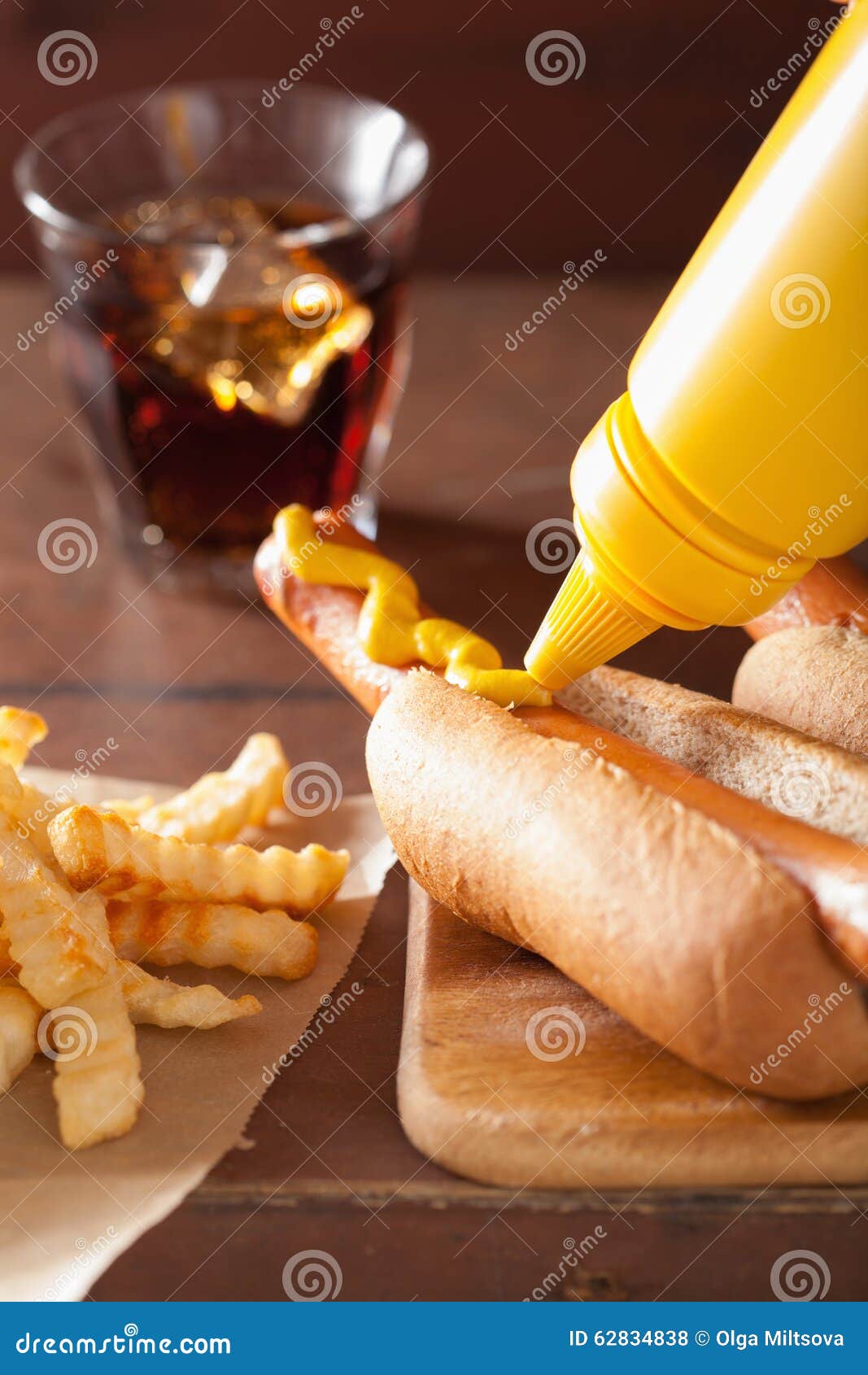 Adding Mustard To Grilled Hot Dog Stock Photo - Image of closeup ...