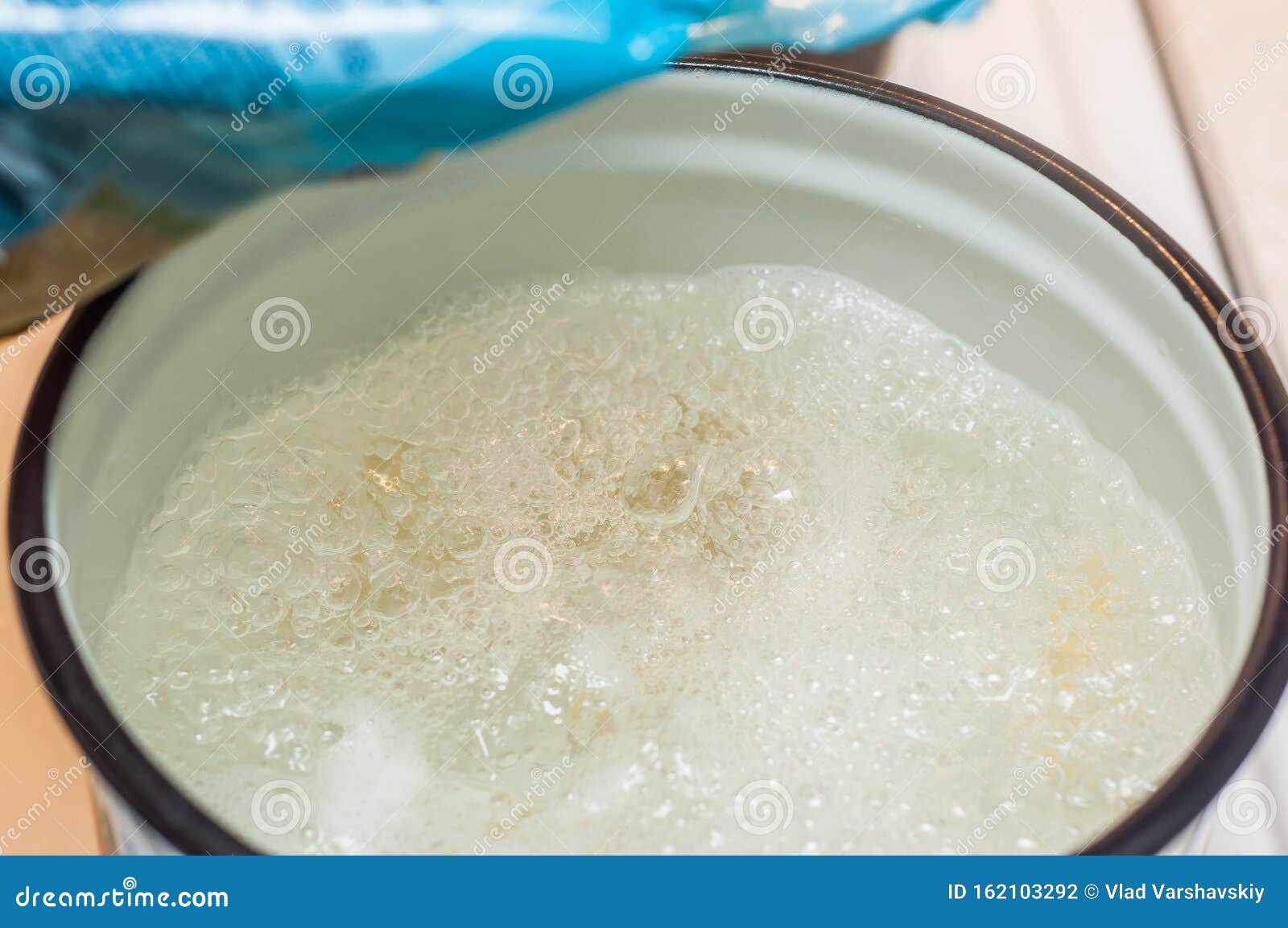 Adding Pasta To Boiling Water from the Packaging Stock Photo - Image of ...