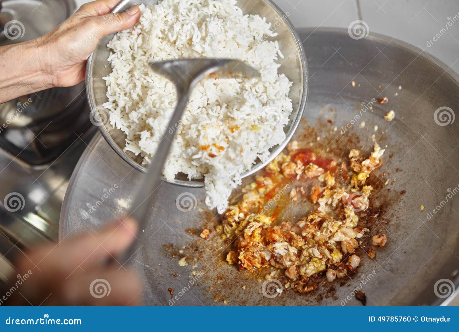 Adding rice stock photo. Image of spatula, stir, kitchen - 49785760