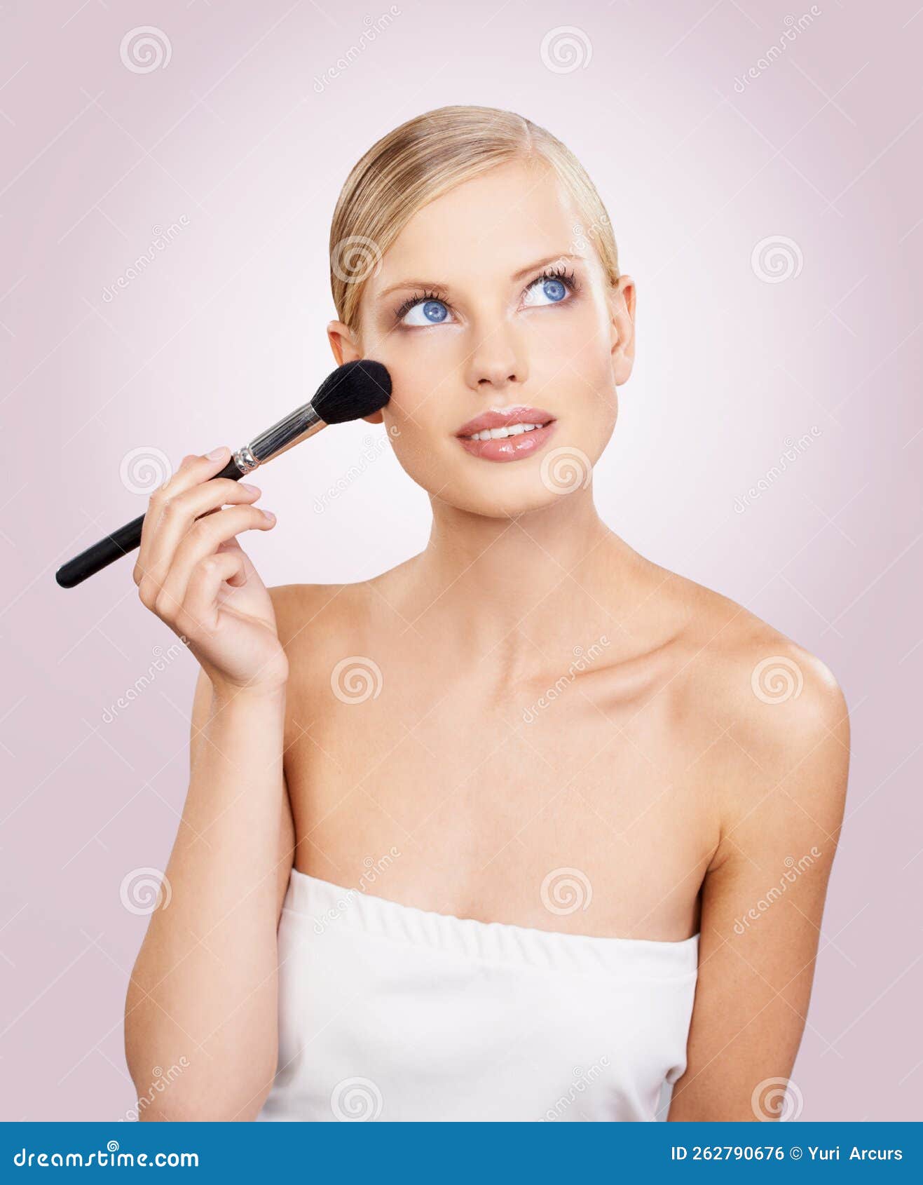 Adding Some Colour To Her Cheeks. a Beautiful Young Woman in the Studio ...