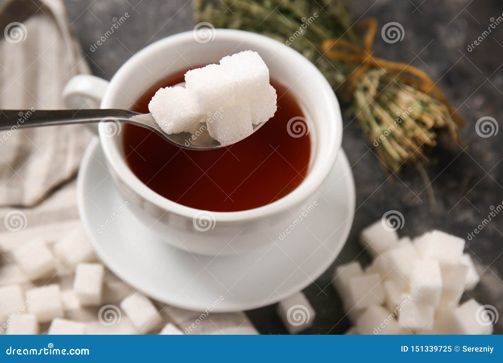 Adding of Sugar To Cup with Aromatic Tea on Grey Table Stock Image ...