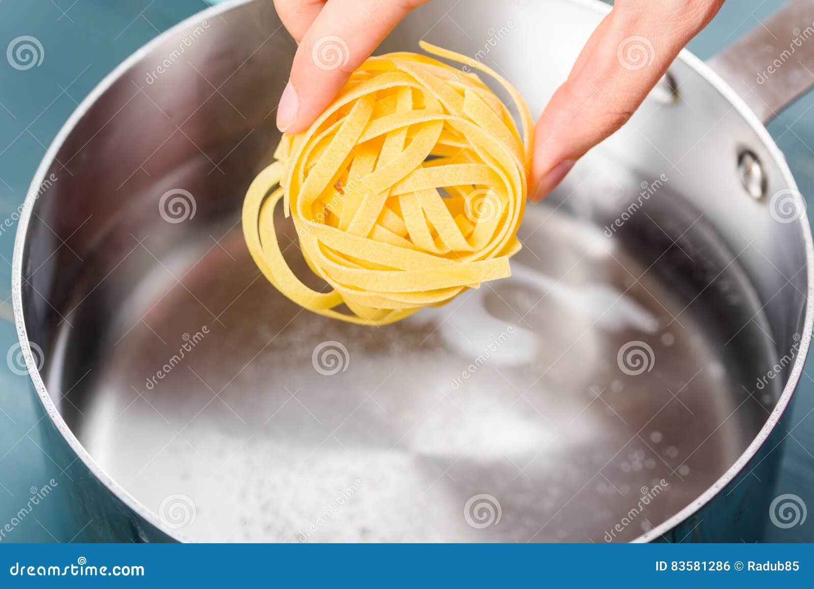 Adding Tagliatelle Pasta in Boiling Hot Water Pot Stock Photo - Image ...