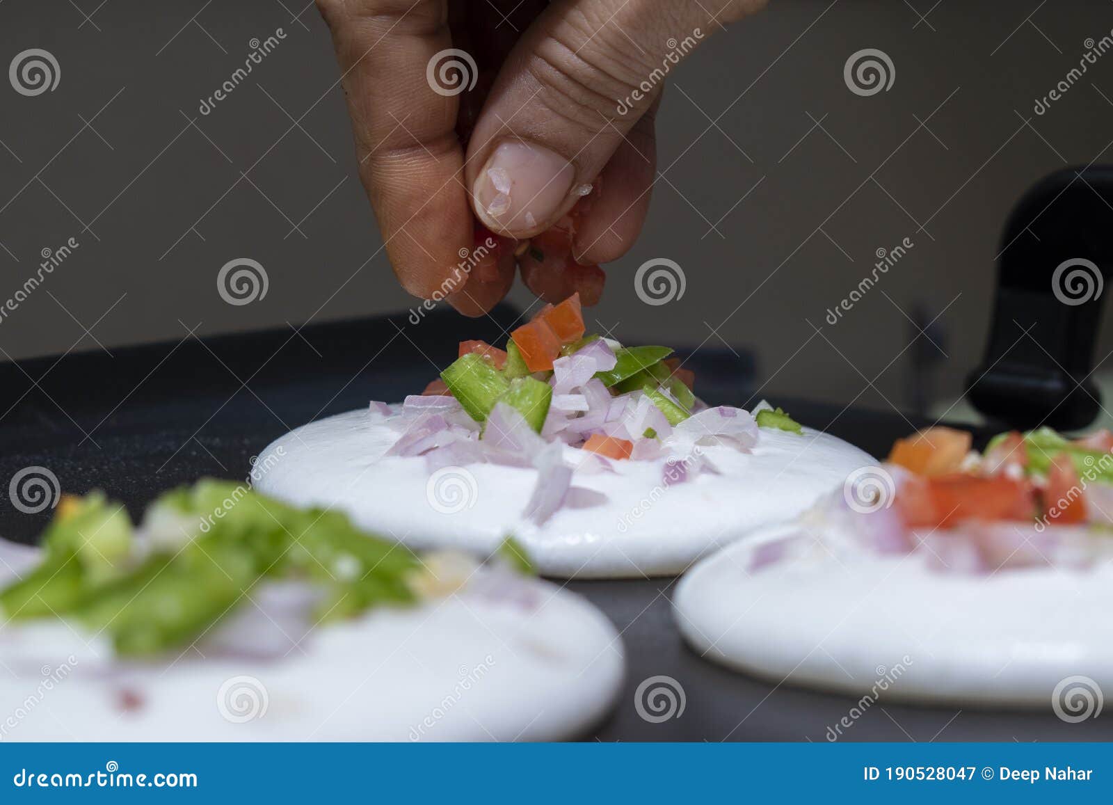 Adding Toppings O Sliced Vegetables on South Indian Dish Stock Image ...