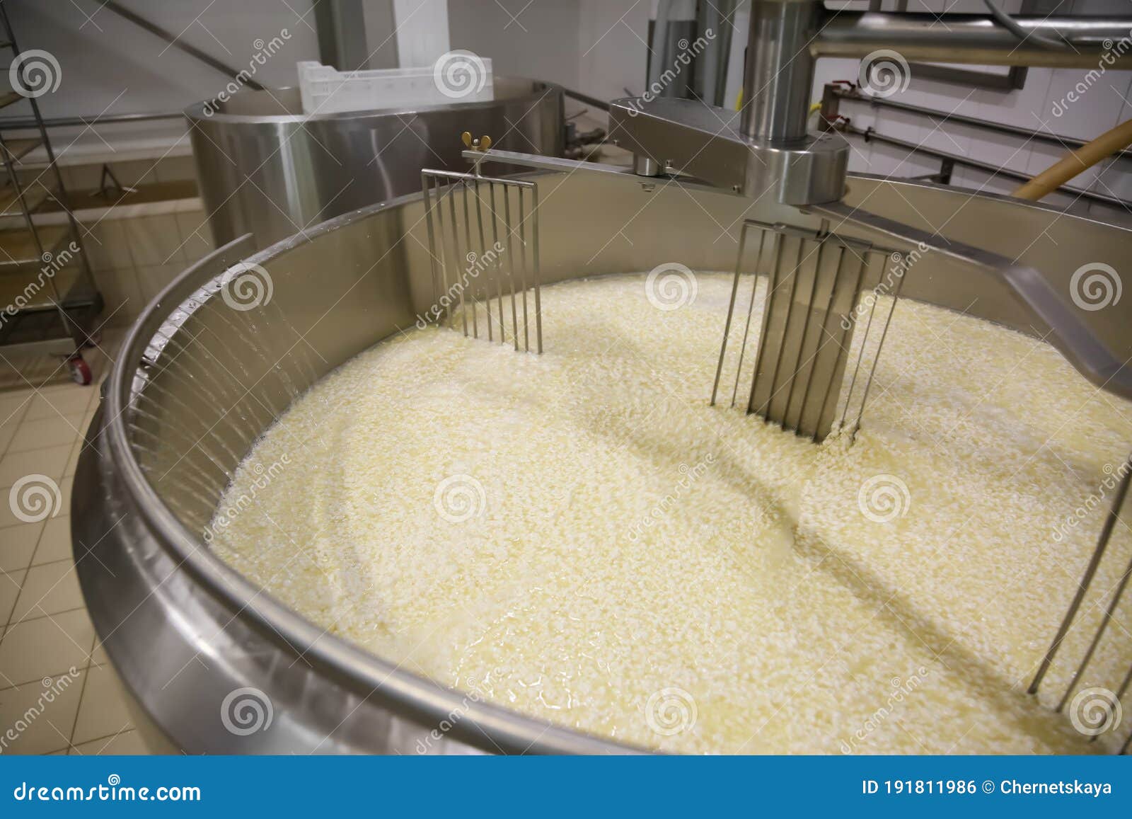 Adding Water To Curd and Whey in Tank at Cheese Factory Stock Photo ...