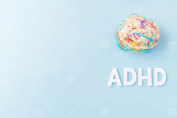 ADHD Concept with Colorful Tangled String Ball on Blue Background Stock ...