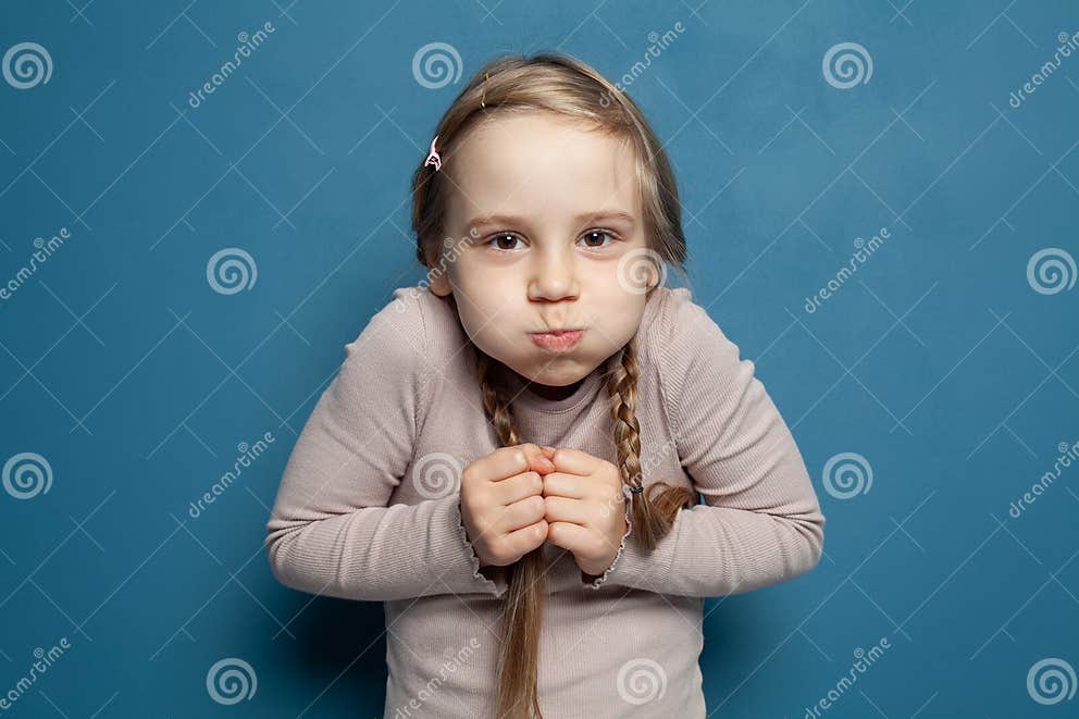 ADHD Hyperactive Child on the Background of Blue Wall Stock Image ...