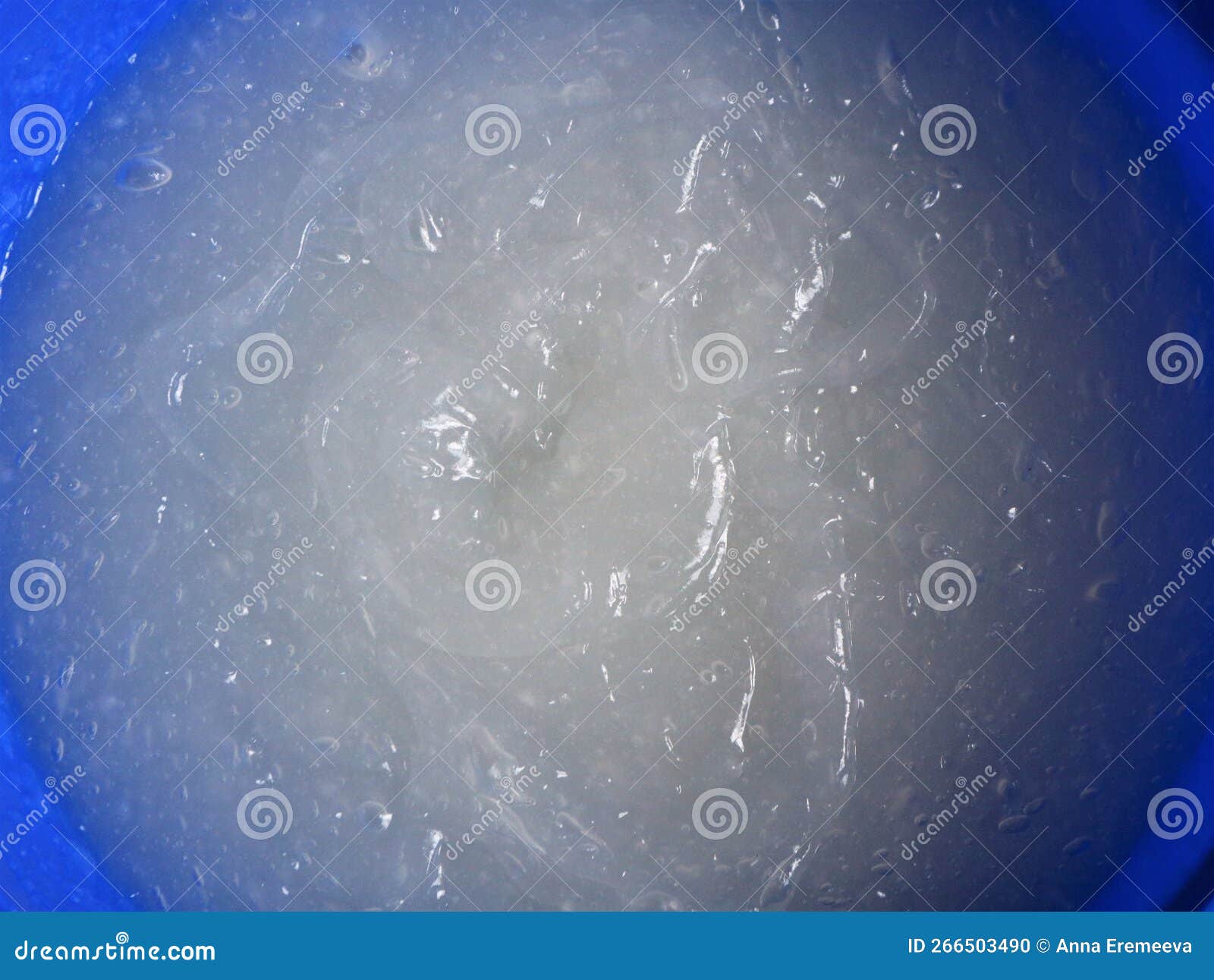 A Mixture of Freshly Diluted Glue in a Container Stock Photo - Image of ...