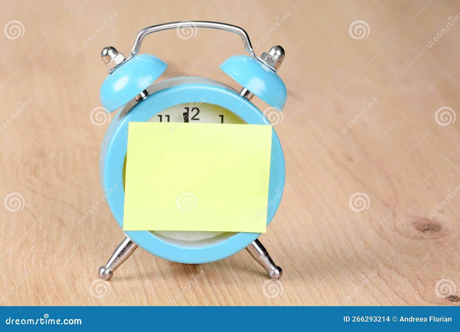 Adhesive Note on a Blue Alarm Clock Stock Photo - Image of writing ...