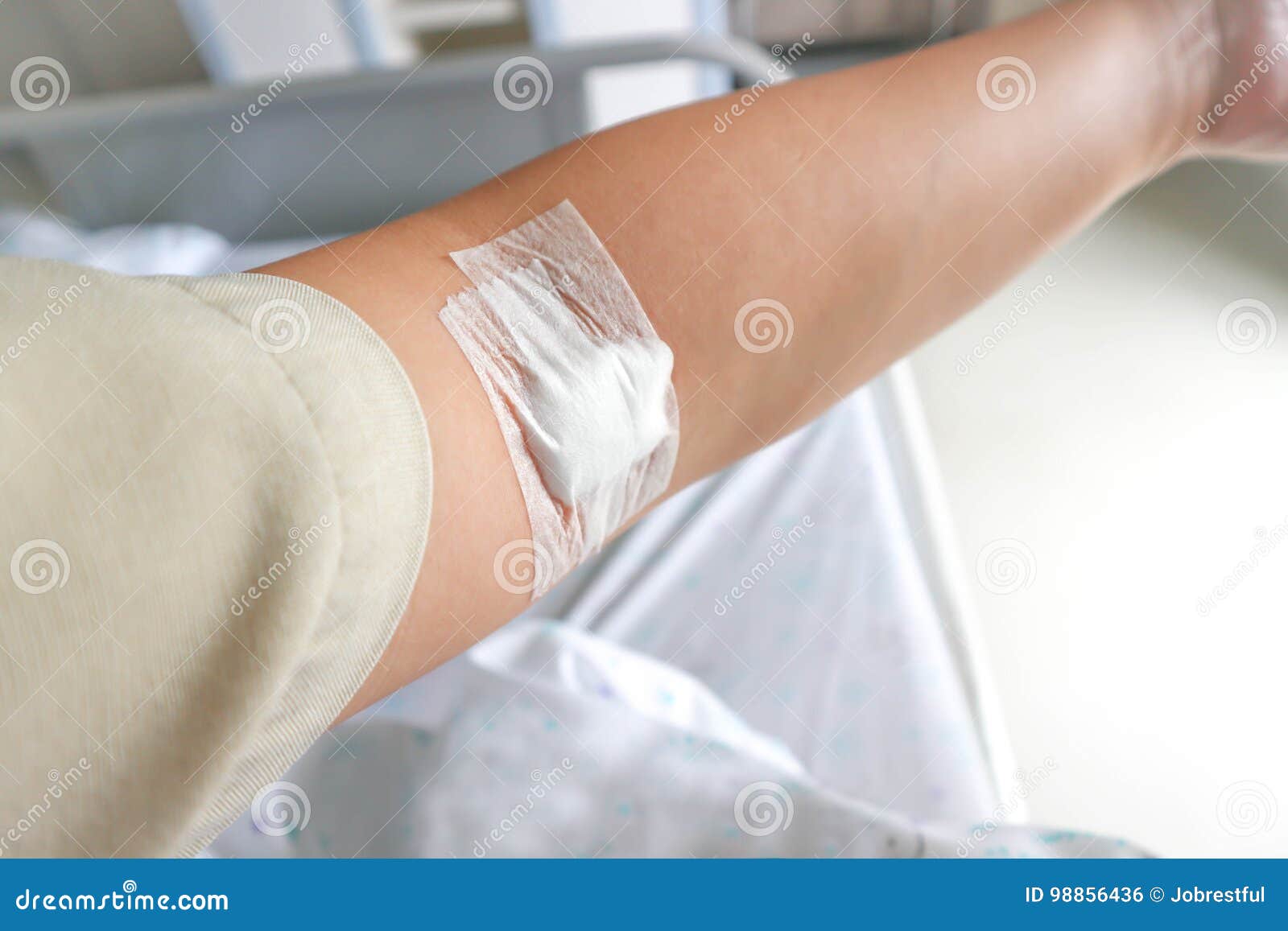 Adhesive plaster on arm stock photo. Image of wounded - 98856436