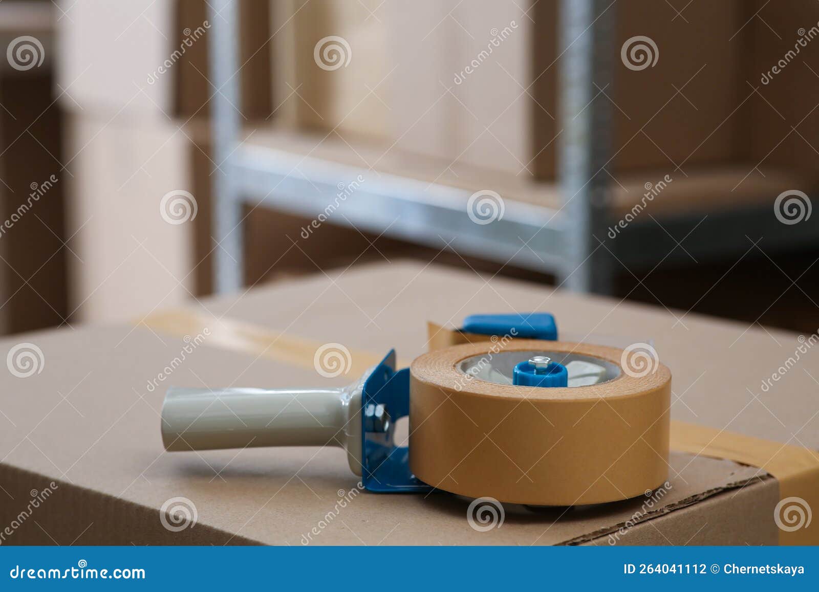 Adhesive Tape Dispenser on Cardboard Box Indoors. Space for Text Stock ...