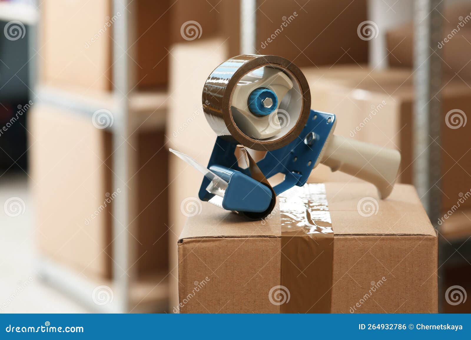 Adhesive Tape Dispenser on Cardboard Box Indoors. Space for Text Stock ...