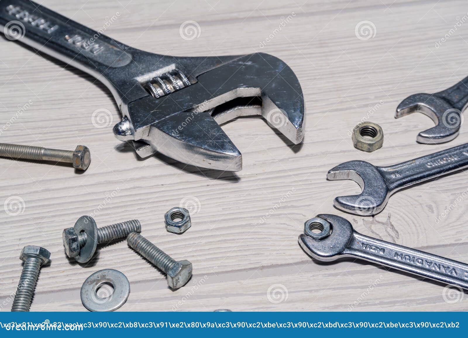 Adjustable and Ordinary Spanners, Nuts and Bolts on the Table Stock ...