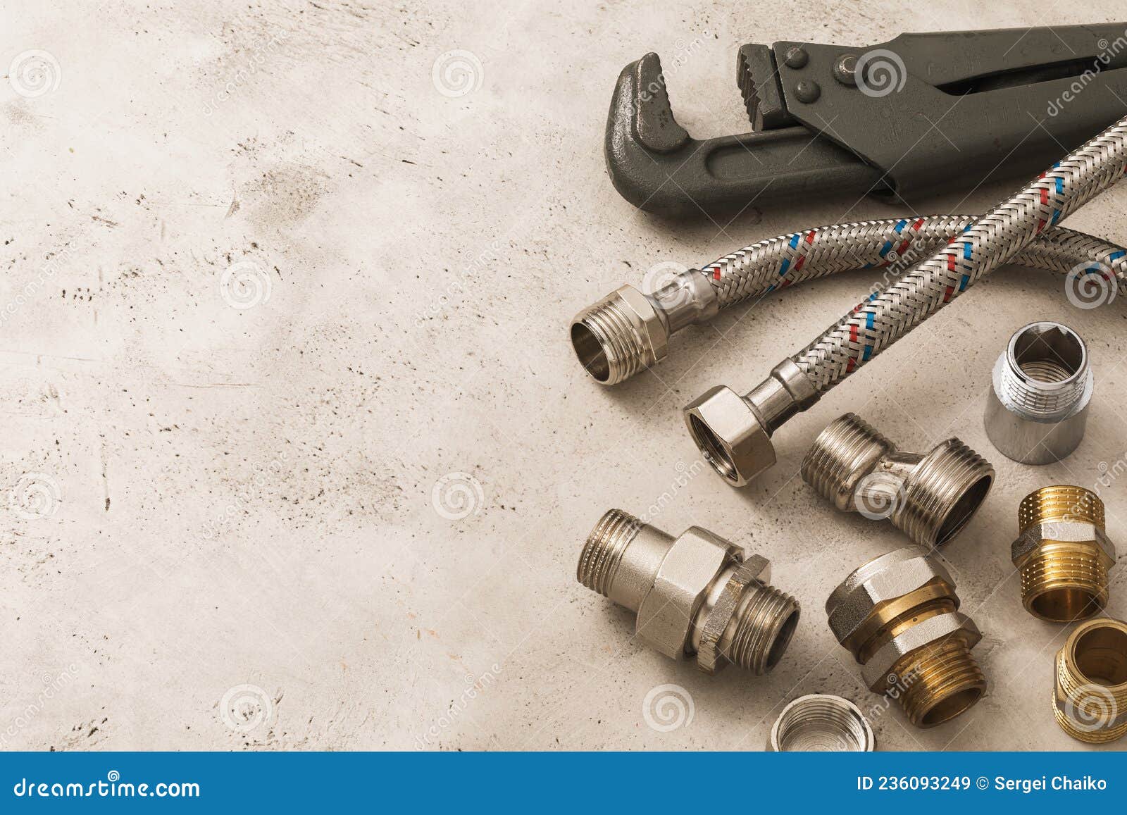 Adjustable Wrench, Flexible Water Hoses and Connecting Adapters on the ...