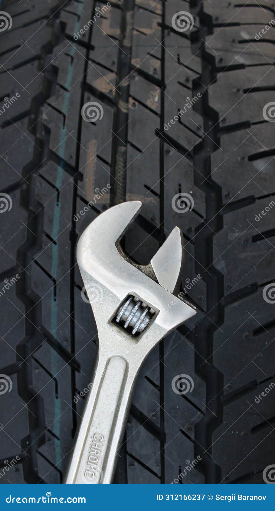 Adjustable Wrench for Wheel Mounting on a Car Tire Surface Stock Image ...