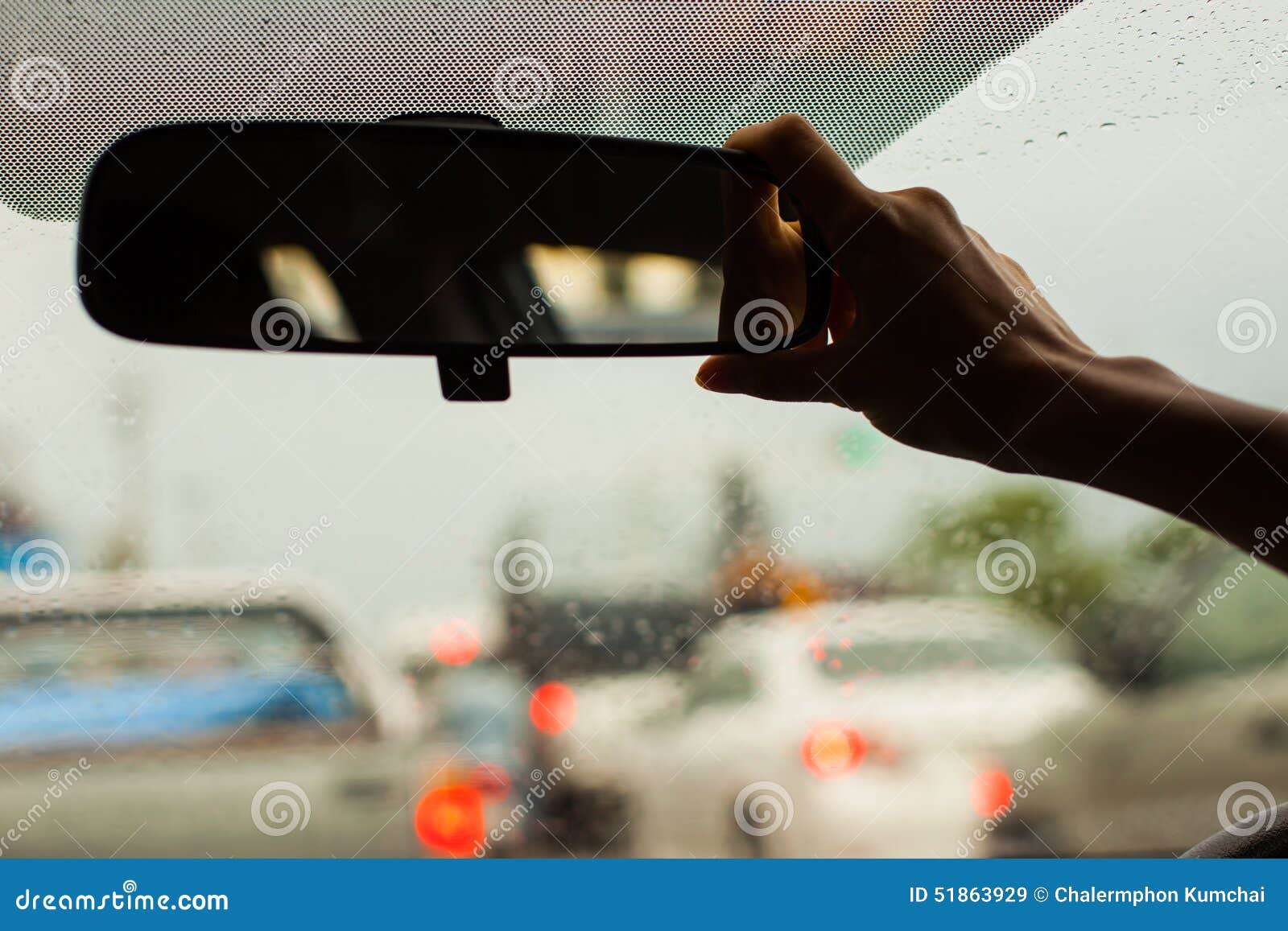 Adjusting Rear View Mirror; Focus on Hand, Silhouette Stock Image ...