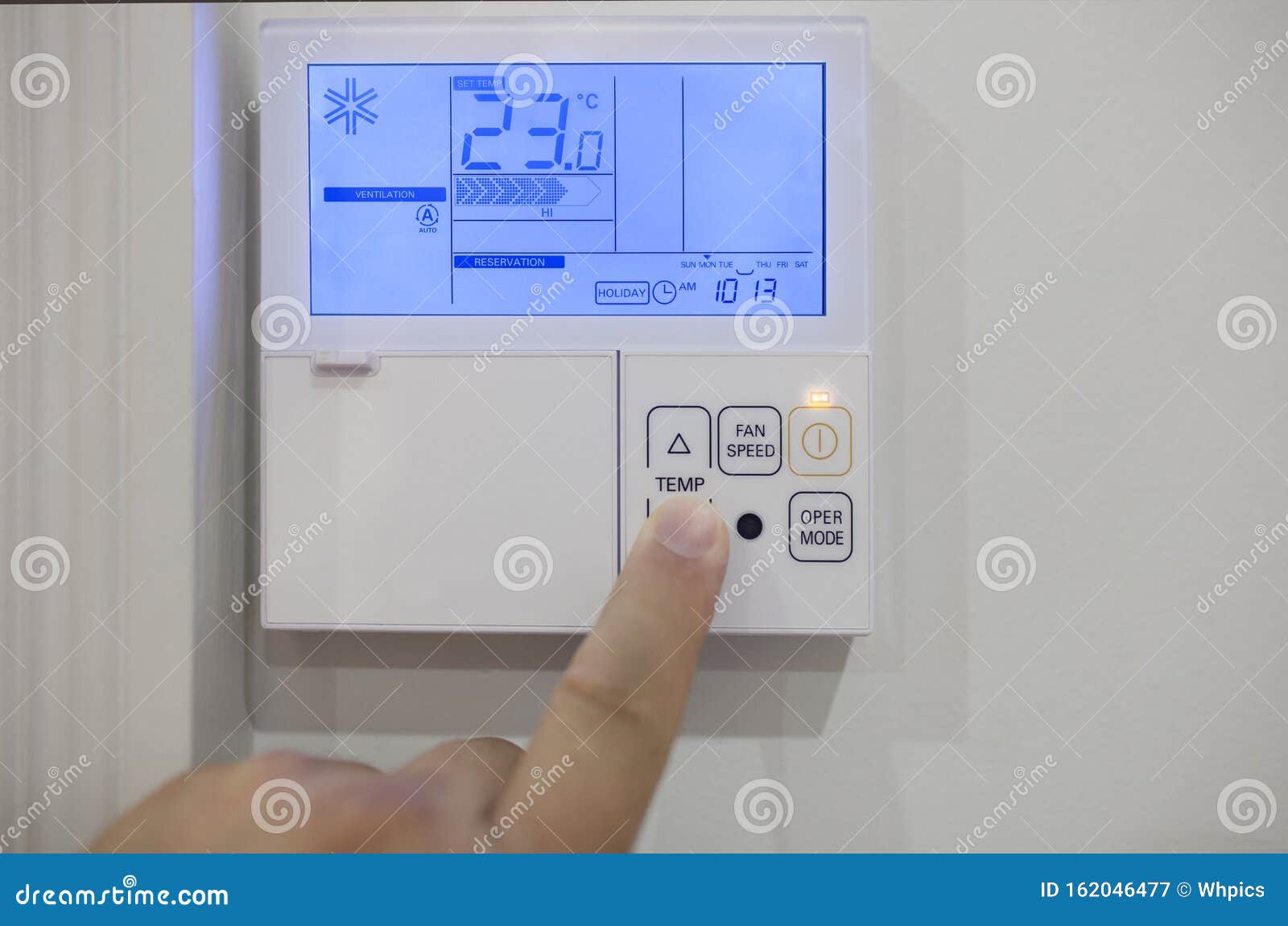 Adjusting Room Climate Control with Electronic Device at Home Stock ...
