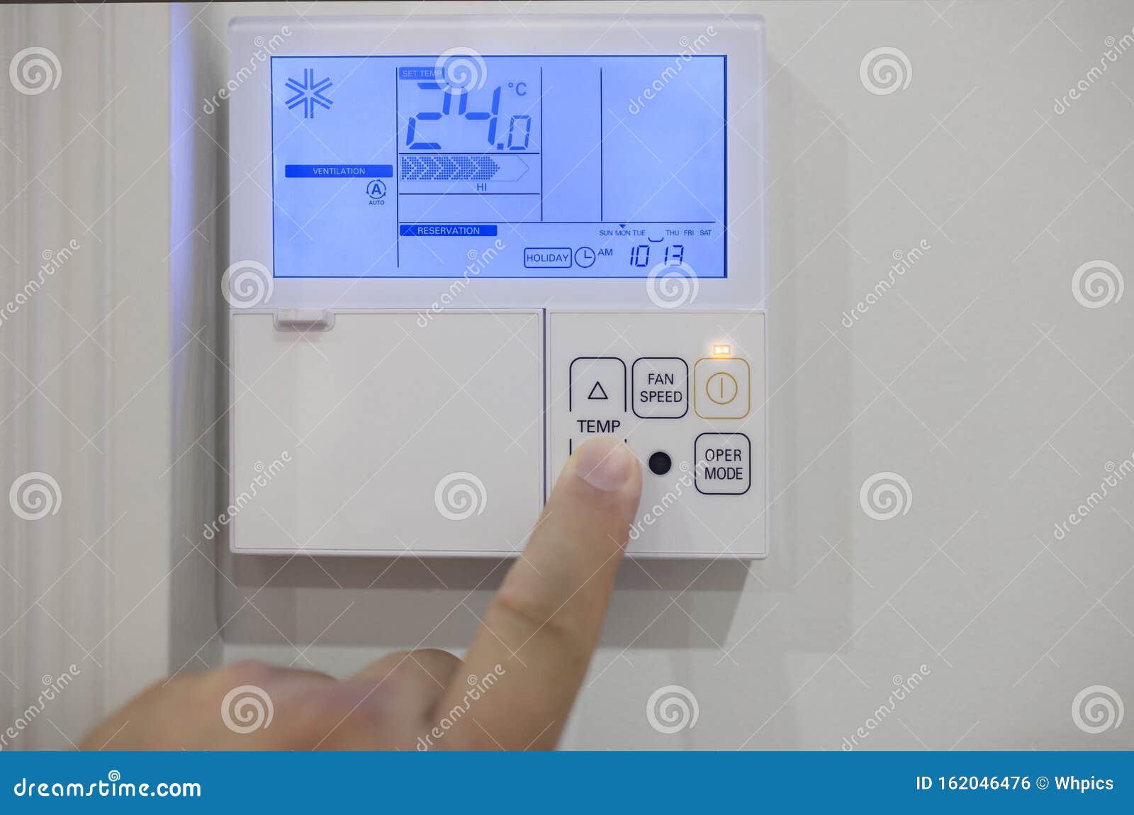Adjusting Room Climate Control with Electronic Device at Home Stock ...