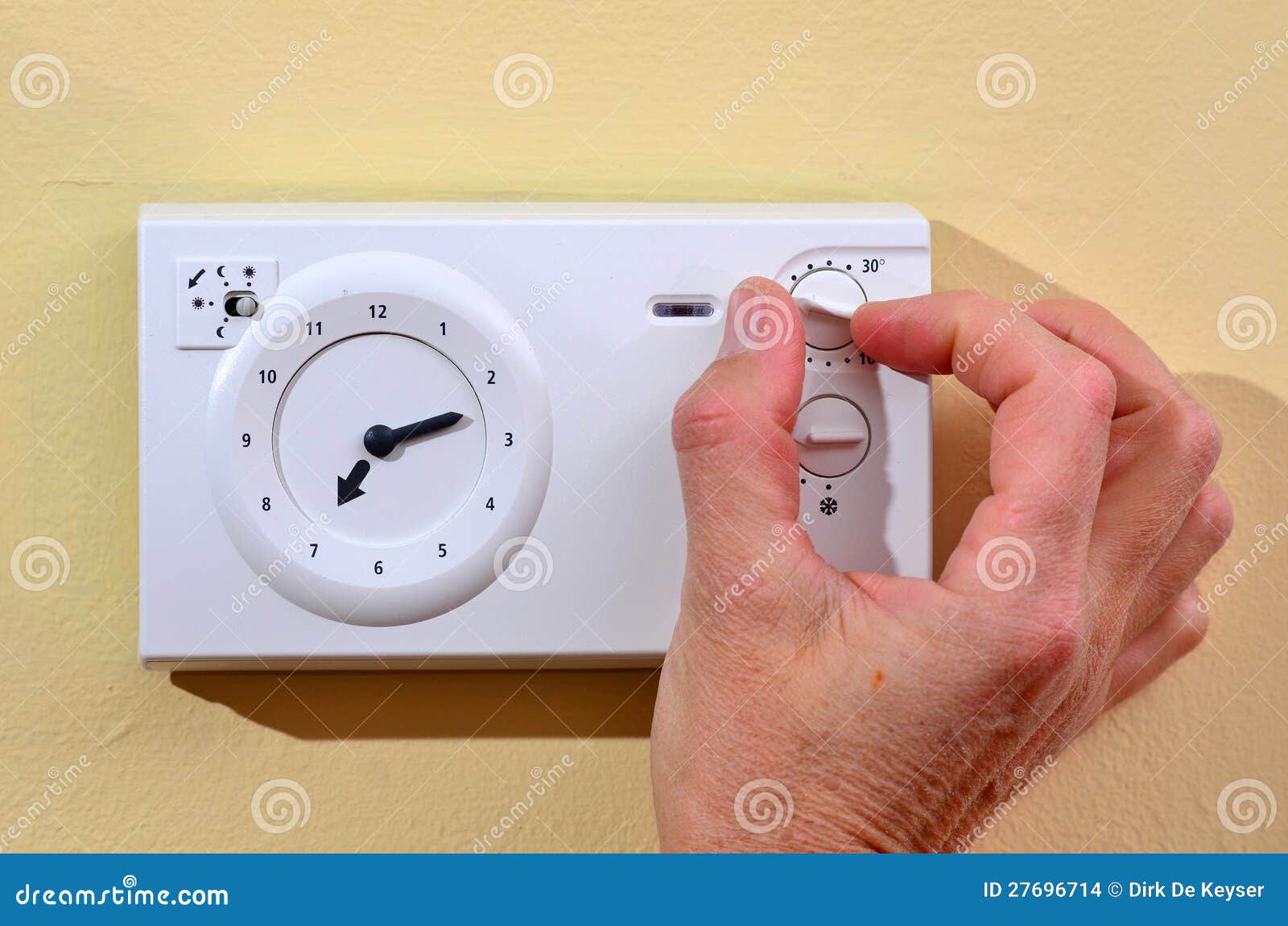 Adjusting Thermostat To Save on Heating Stock Photo - Image of system ...