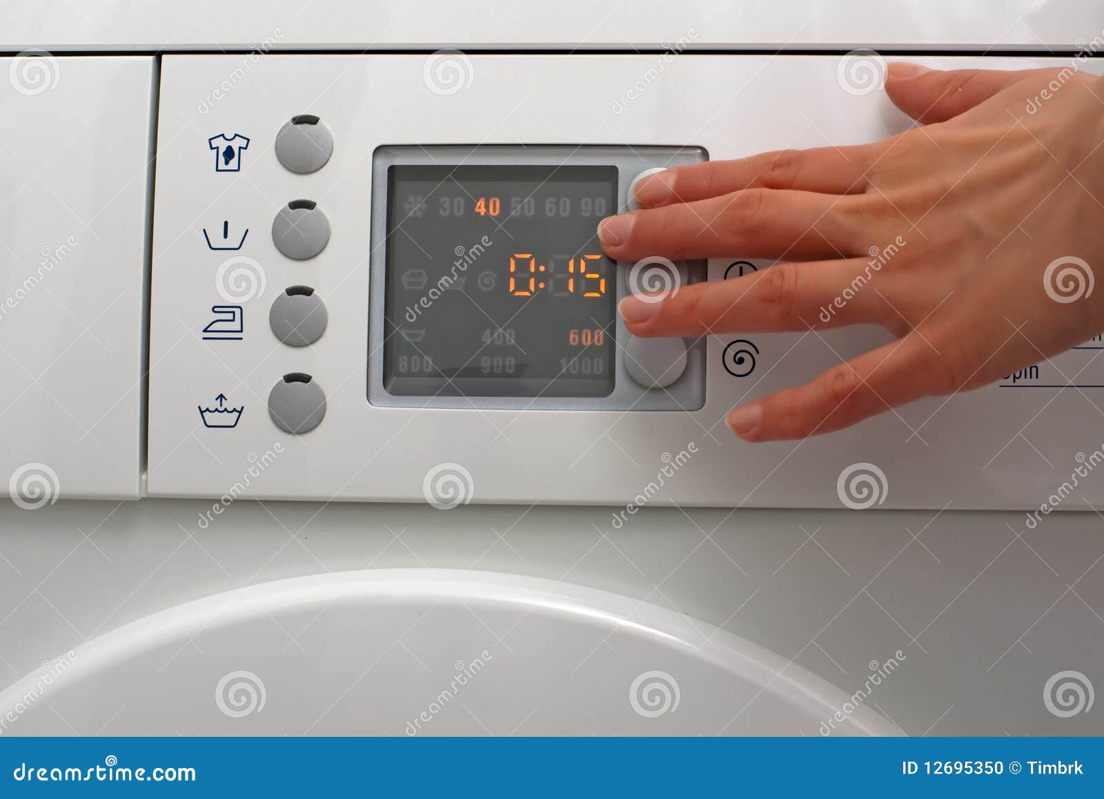 Adjusting a Washing Machine Stock Photo - Image of washer, display ...