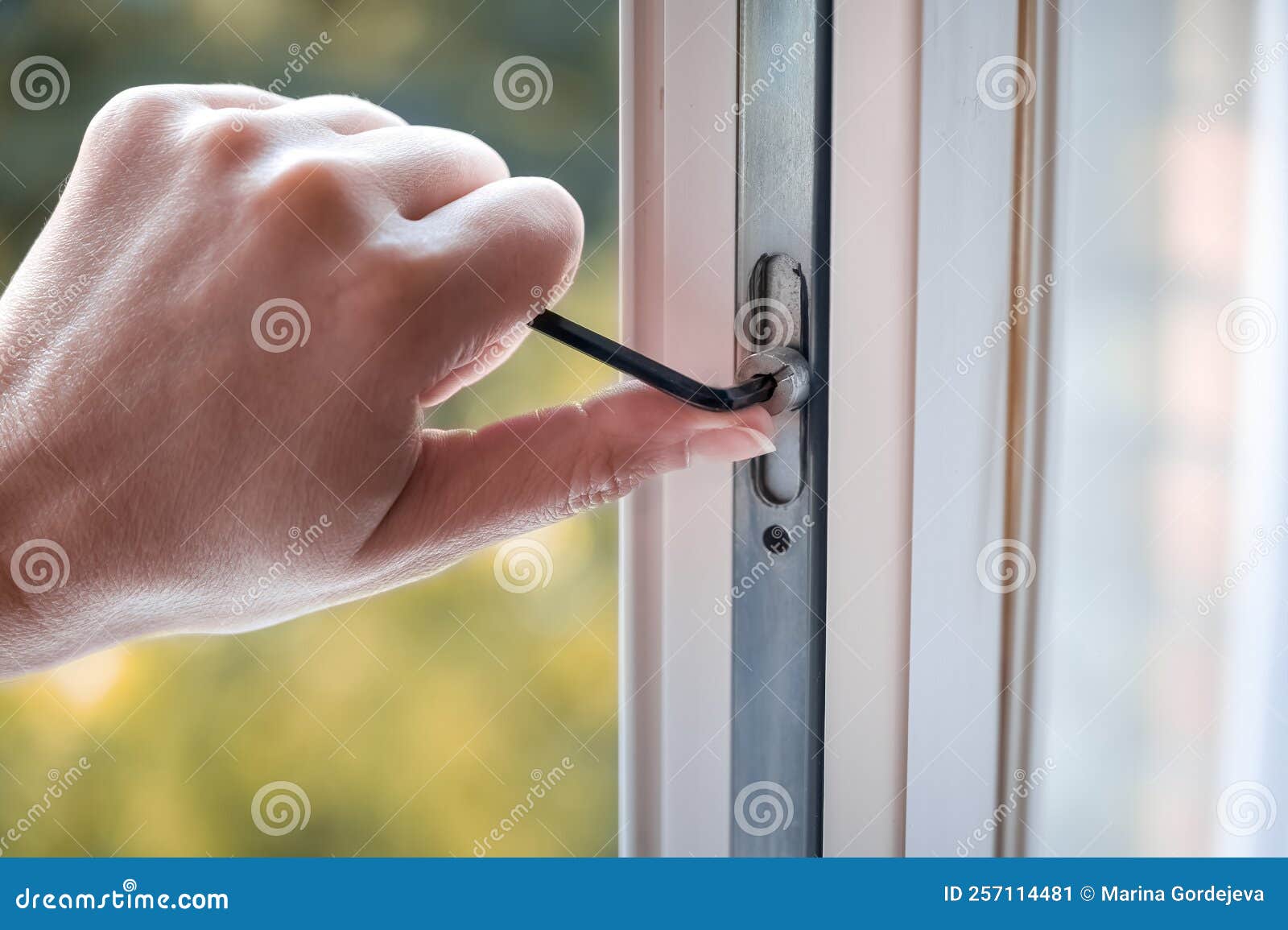 Adjusting the White Plastic Window. a Worker Uses a Hexagon To Repair a ...