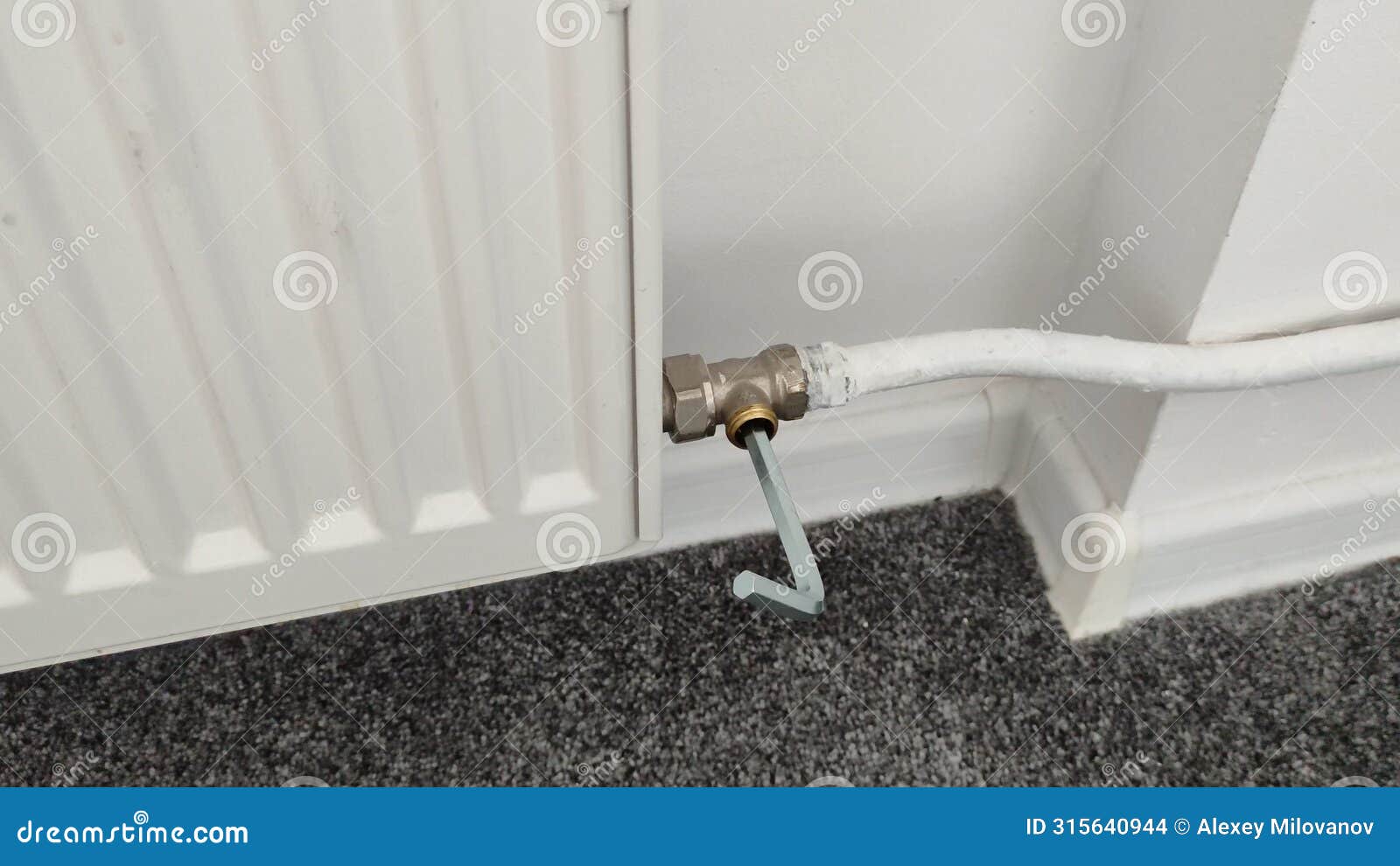 Adjustment Key is Inserted into the Heating Radiator Regulator Stock ...