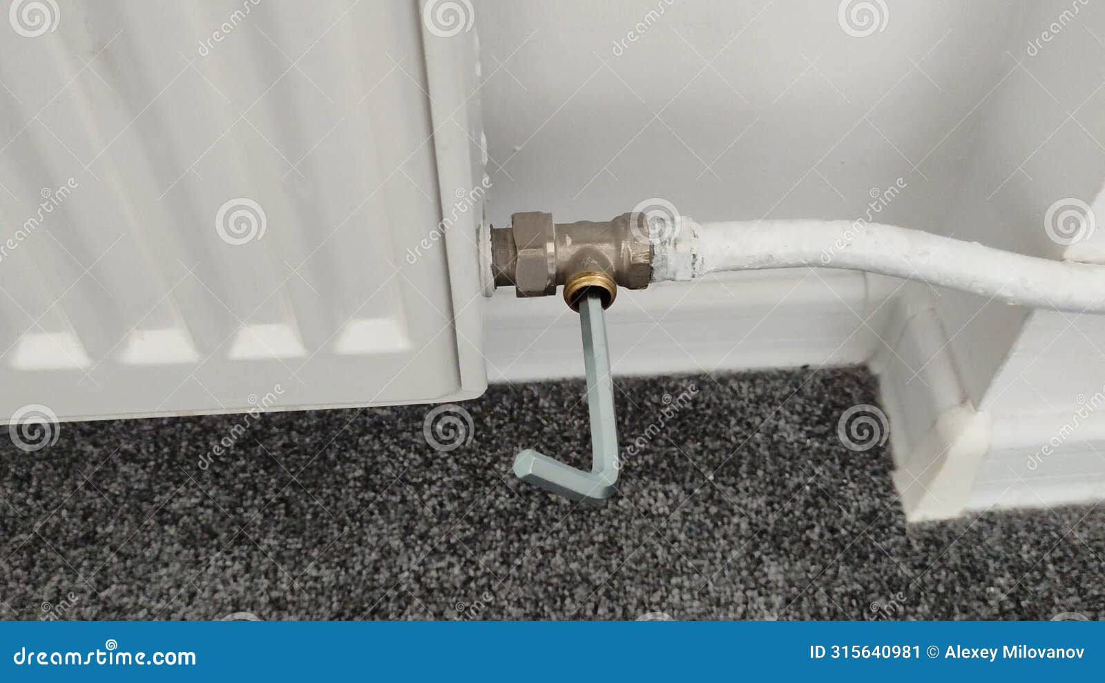 Adjustment Key is Pulled Out of the Heating Radiator Regulator Stock ...