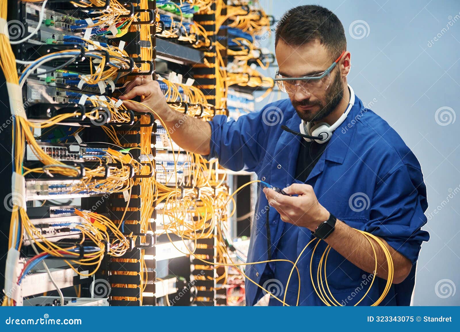 Administrator is Busy. Young Man is Working with Internet Equipment and ...