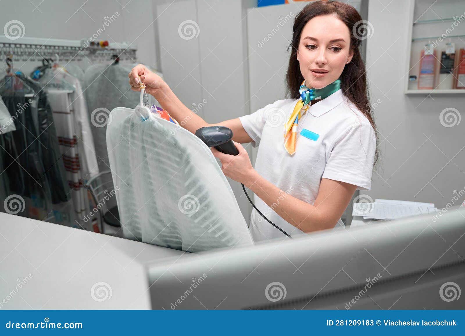 Administrator of Dry-cleaning Office Scanning Barcode on Tag on Garment ...