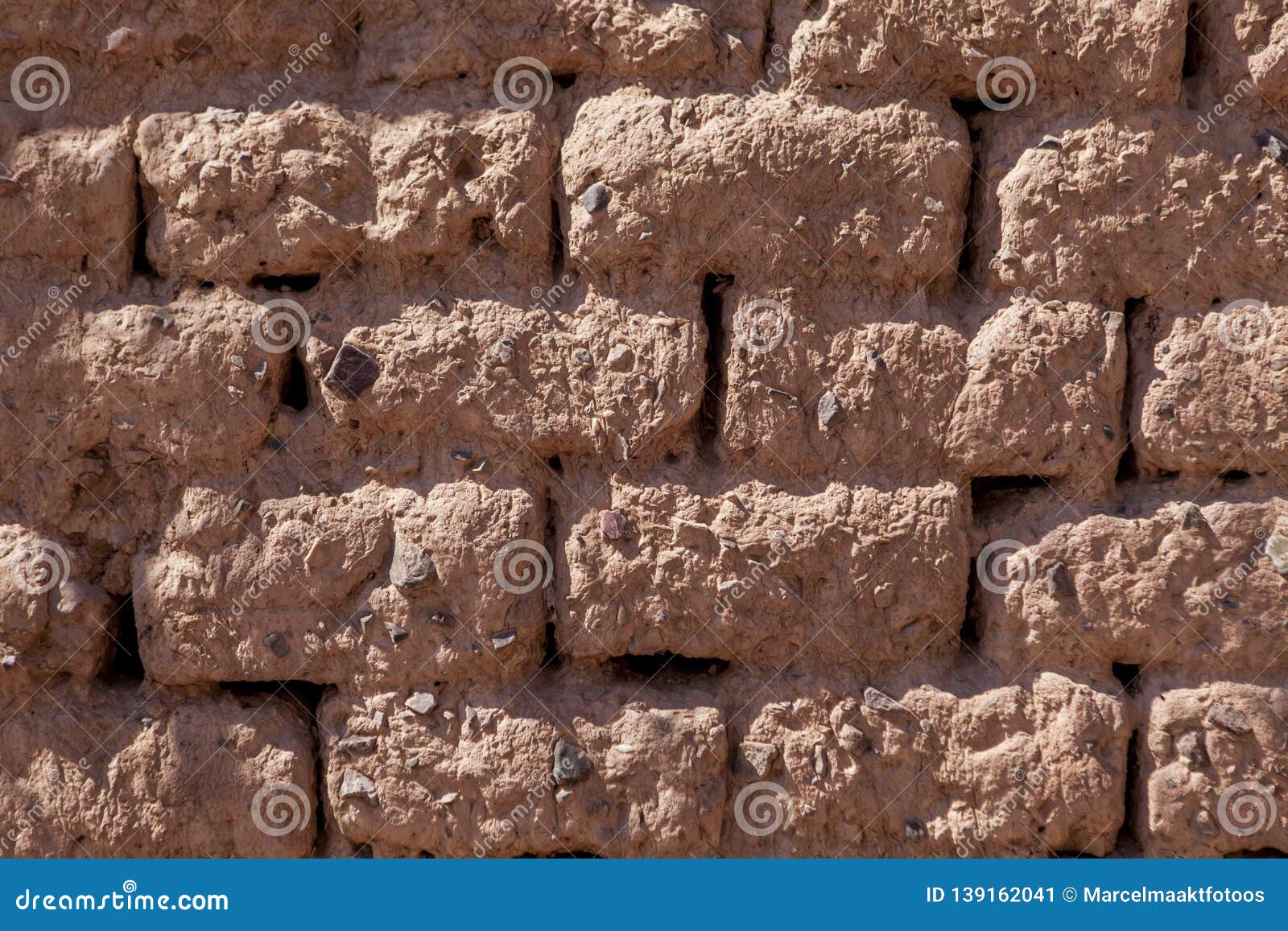 An Adobe Brick Wall in Sunny Floodlight Stock Image - Image of ...