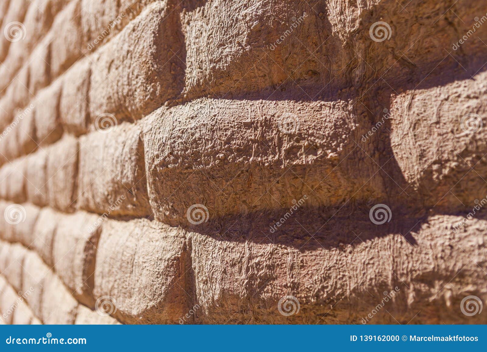 An Adobe Brick Wall in Full Sunlight Stock Photo - Image of sunlight ...