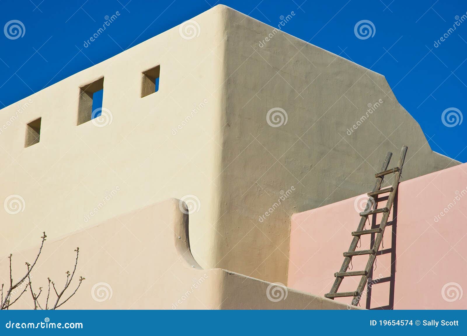 Adobe Style Building With Flat Roof And Balcony With Rain Gutter Posts ...