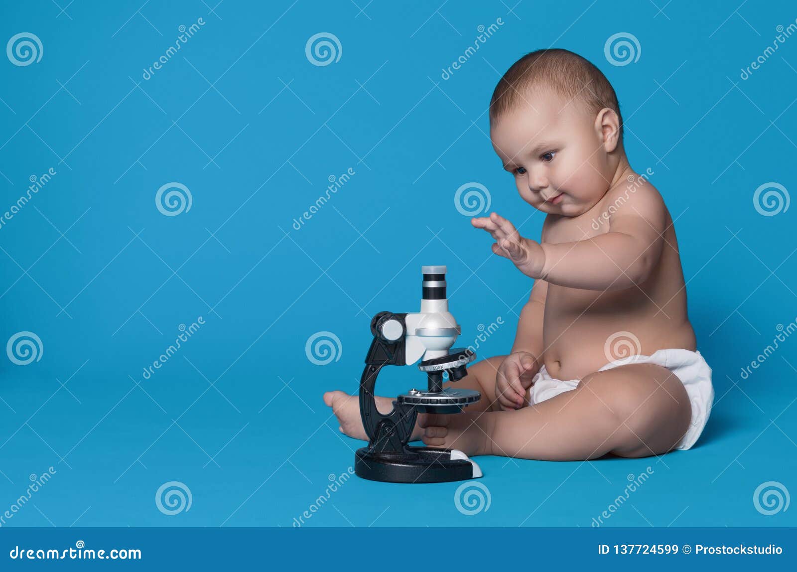 Baby With Microscope. Stock Photo | CartoonDealer.com #4125630