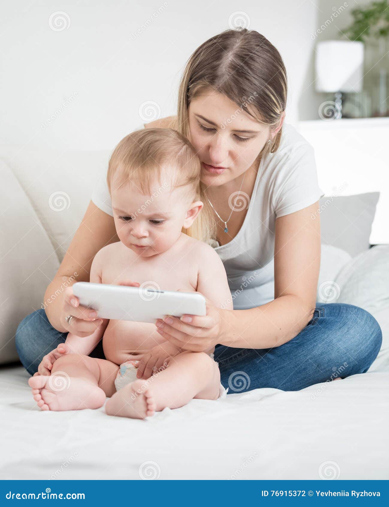 Adorable Baby in Diapers Using Tablet PC with His Mother Stock Photo ...