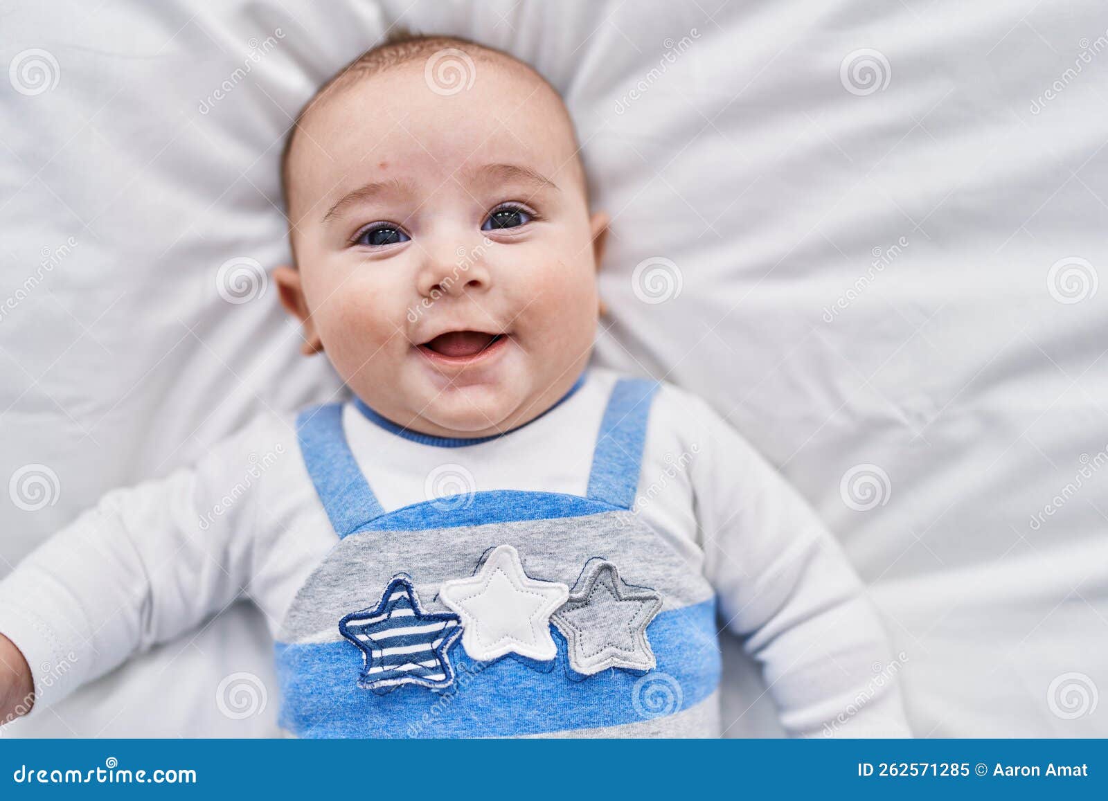 Adorable Baby Smiling Confident Lying on Bed at Bedroom Stock Image ...